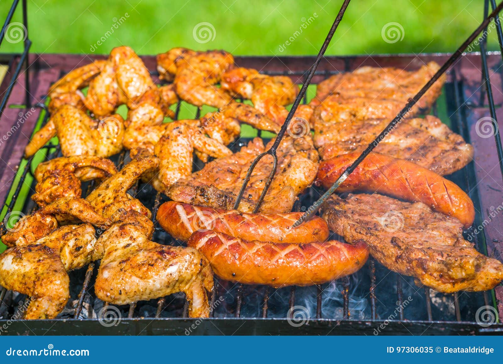 BBQ in the Garden - Selection of Meat on Flaming Grill Stock Image ...
