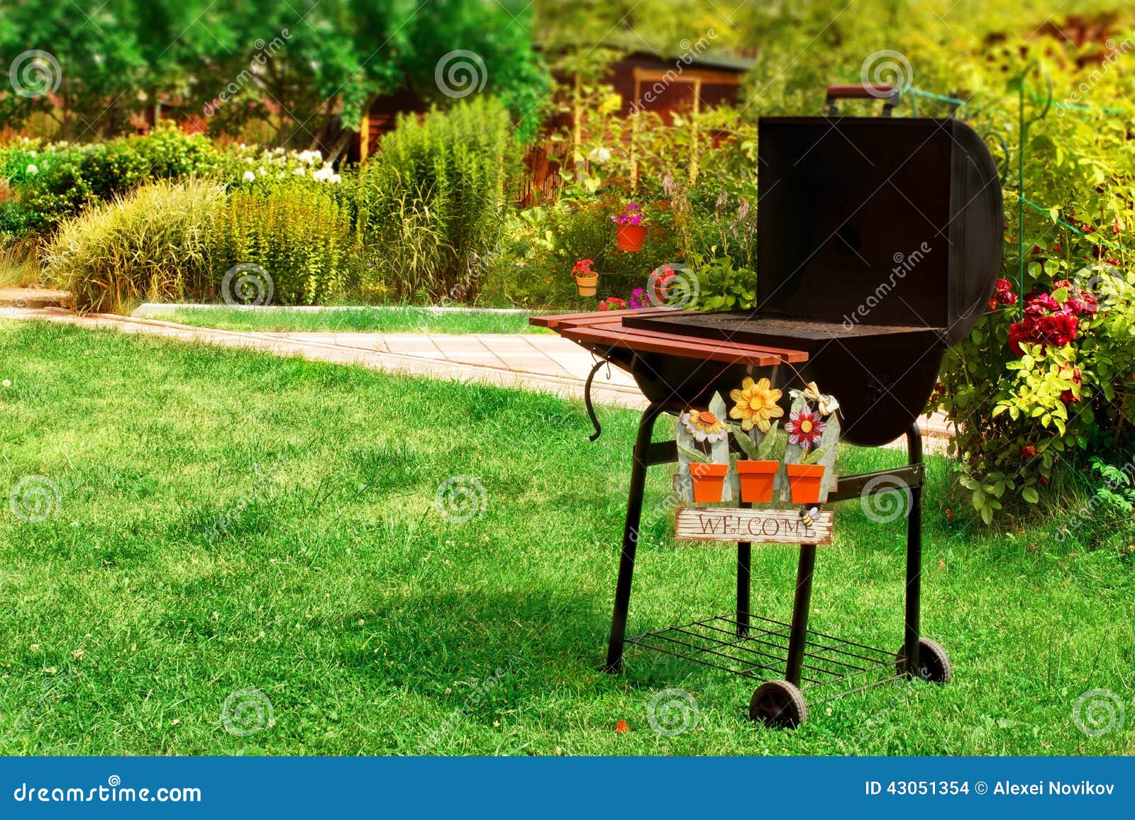 BBQ Grill and WELCOME Sign in the Backyard Stock Photo - Image of ...