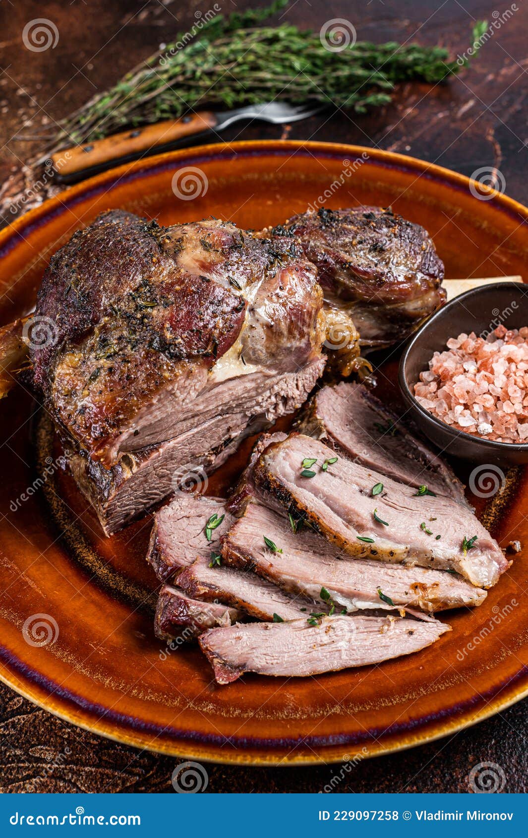 BBQ Roast Lamb Mutton Leg Sliced on a Rustic Plate. Dark Background ...