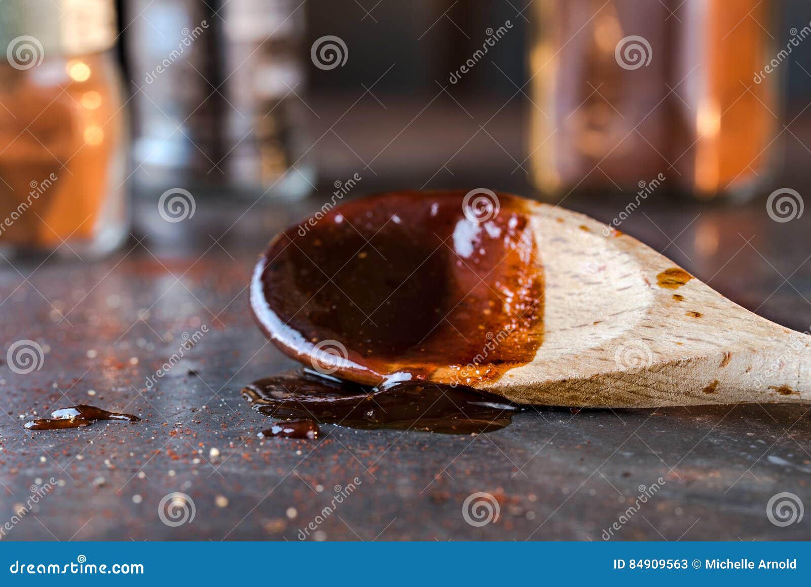 BBQ Sauce on a Wood Spoon stock image. Image of condiment - 84909563