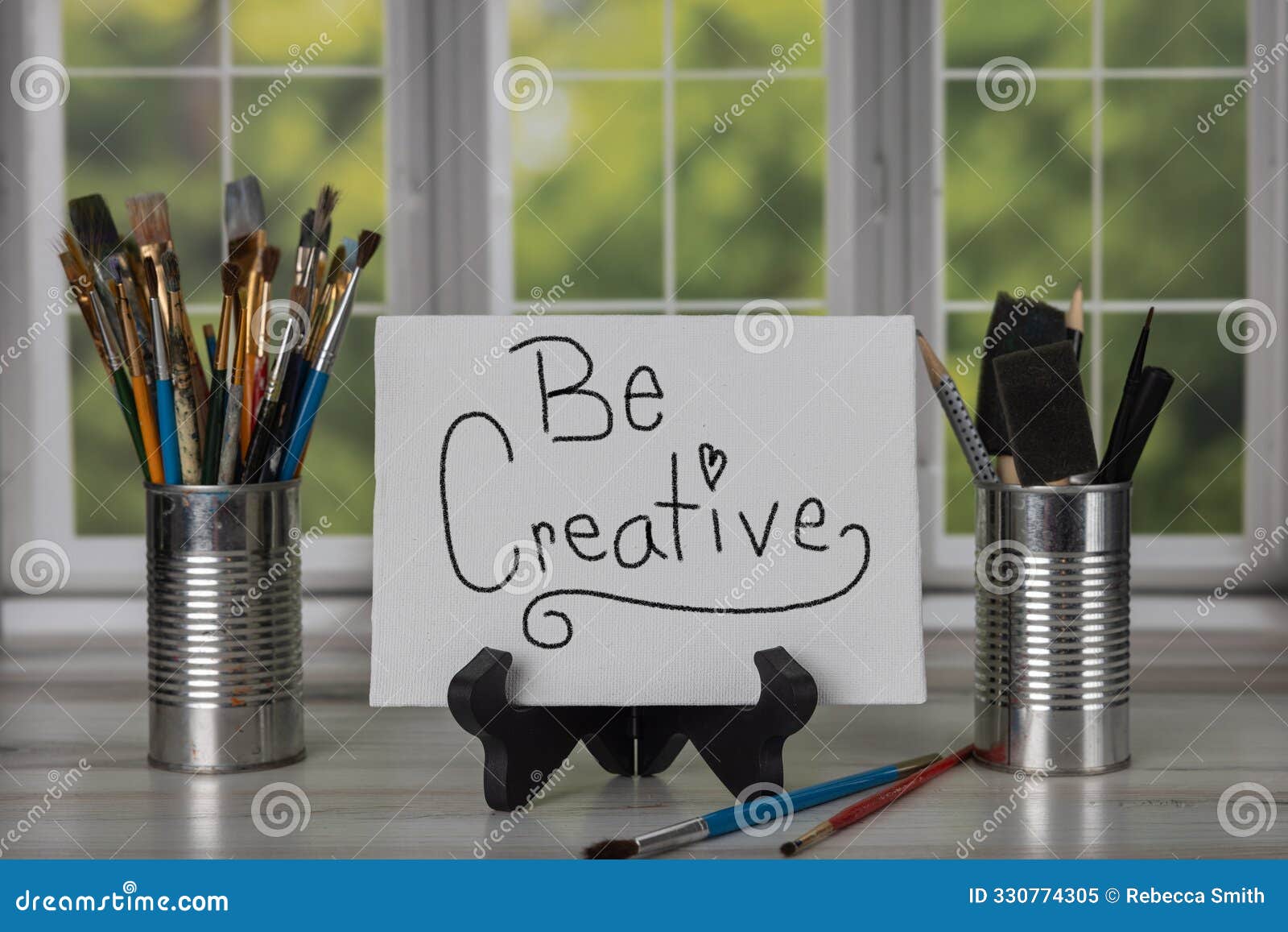 Be Creative, Sign Hand Written on White Canvas Sitting on Easel with ...