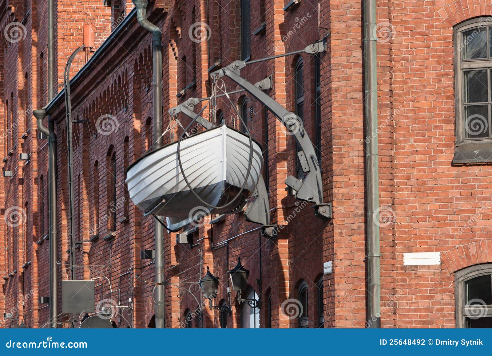 A Be Hanging Boat on Old Red Brick Wall Stock Photo - Image of ...