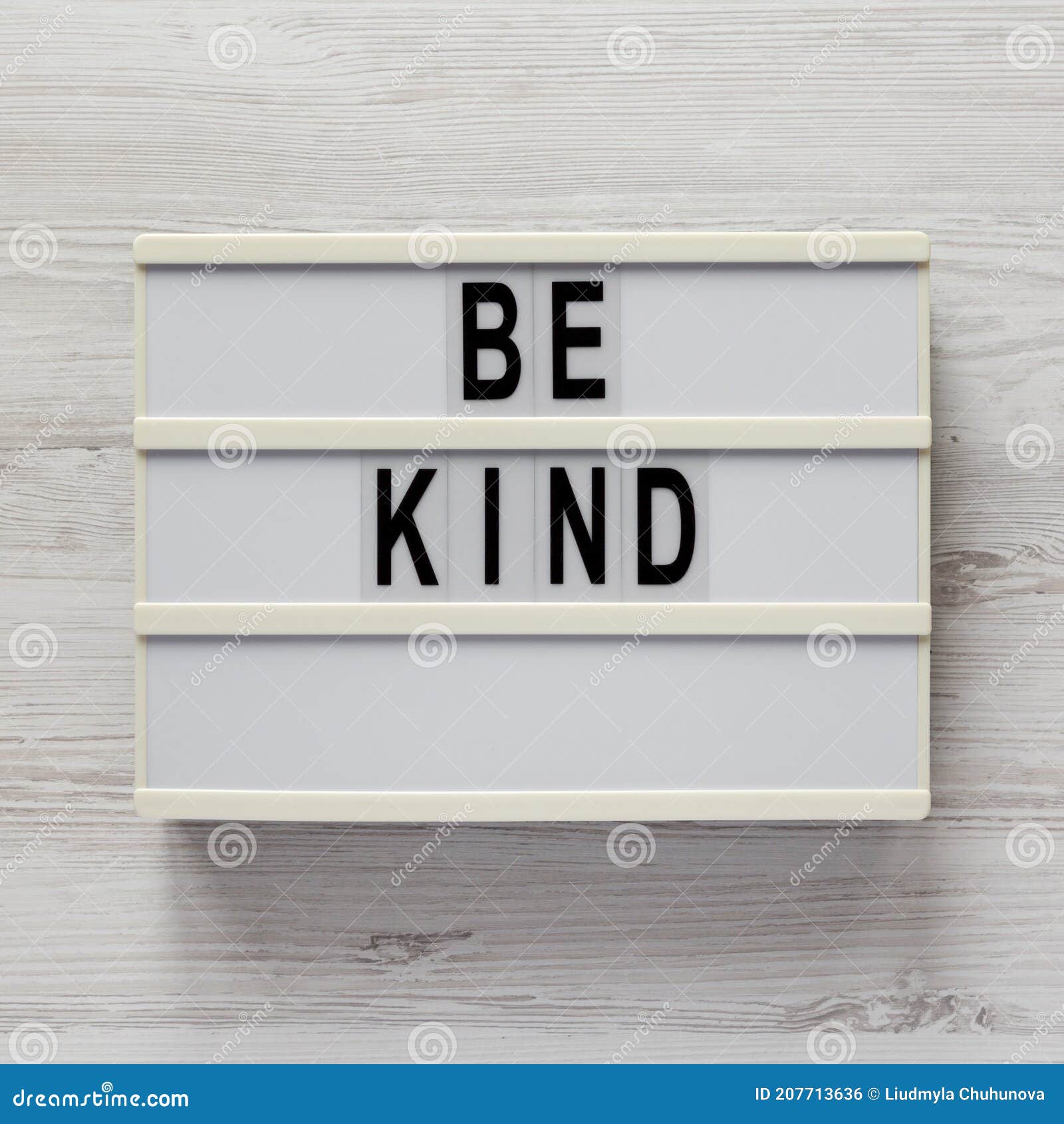 `Be Kind` on a Lightbox on a White Wooden Background, Top View. Flat ...