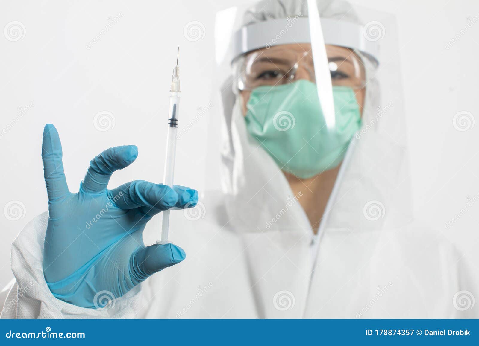A Young Apprentice Wearing a Mask and Protective Suit is Holding a ...