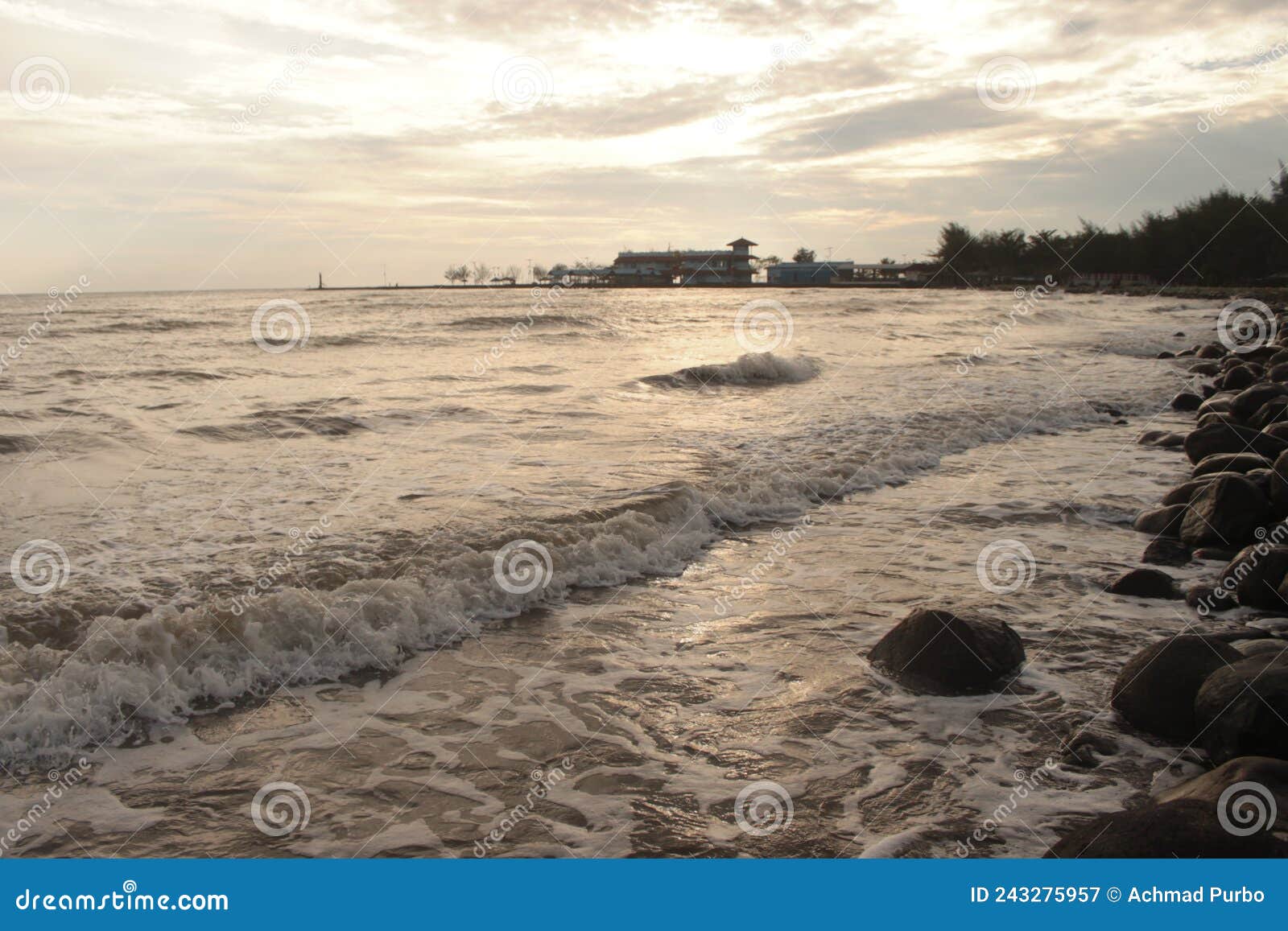 Beach Atmosphere with Small Waves Hitting the Rocks Stock Image - Image ...