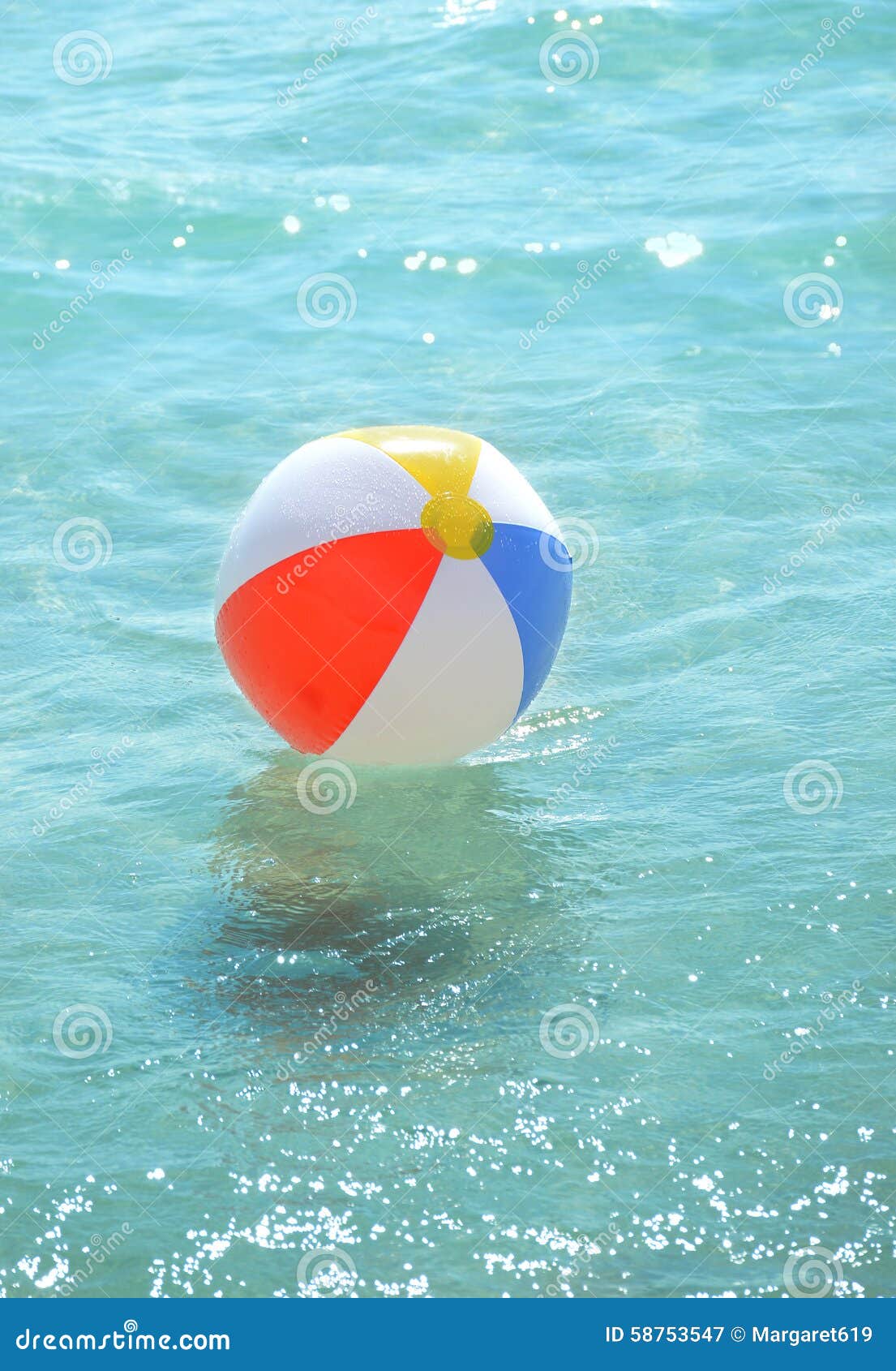 Beach Ball Floating in the Ocean. Stock Image - Image of recreational ...