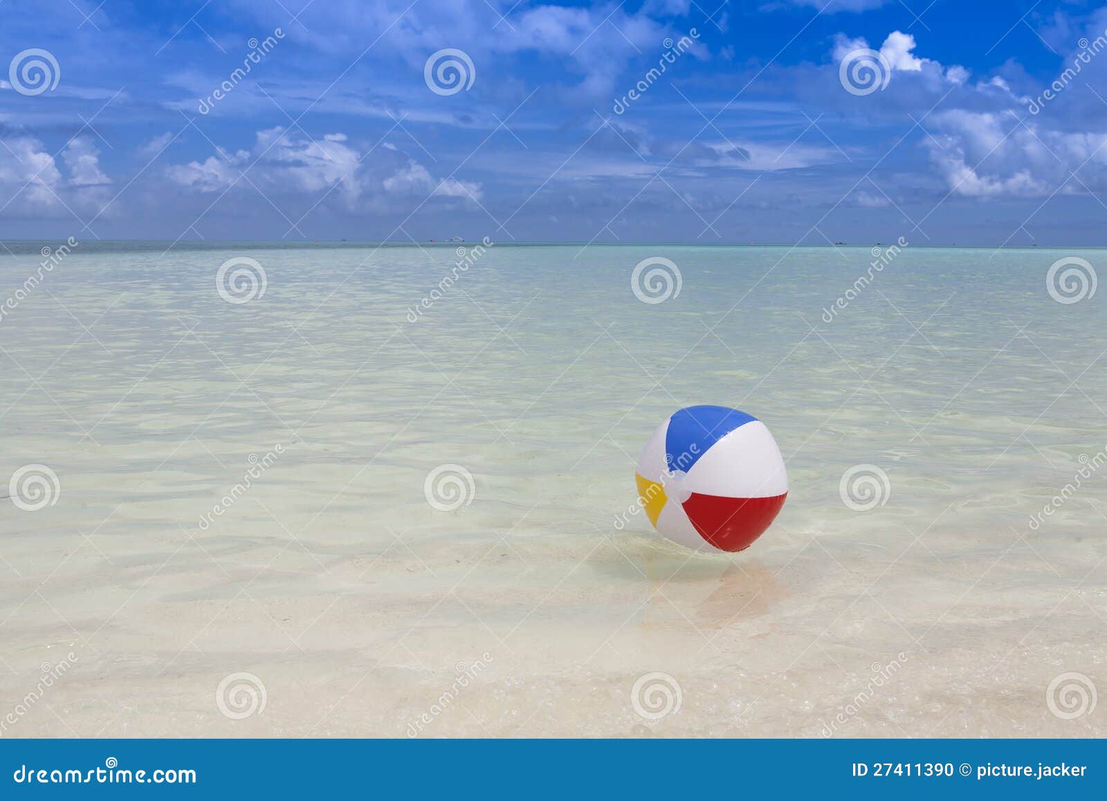 Beach ball in the sea stock photo. Image of landscape - 27411390