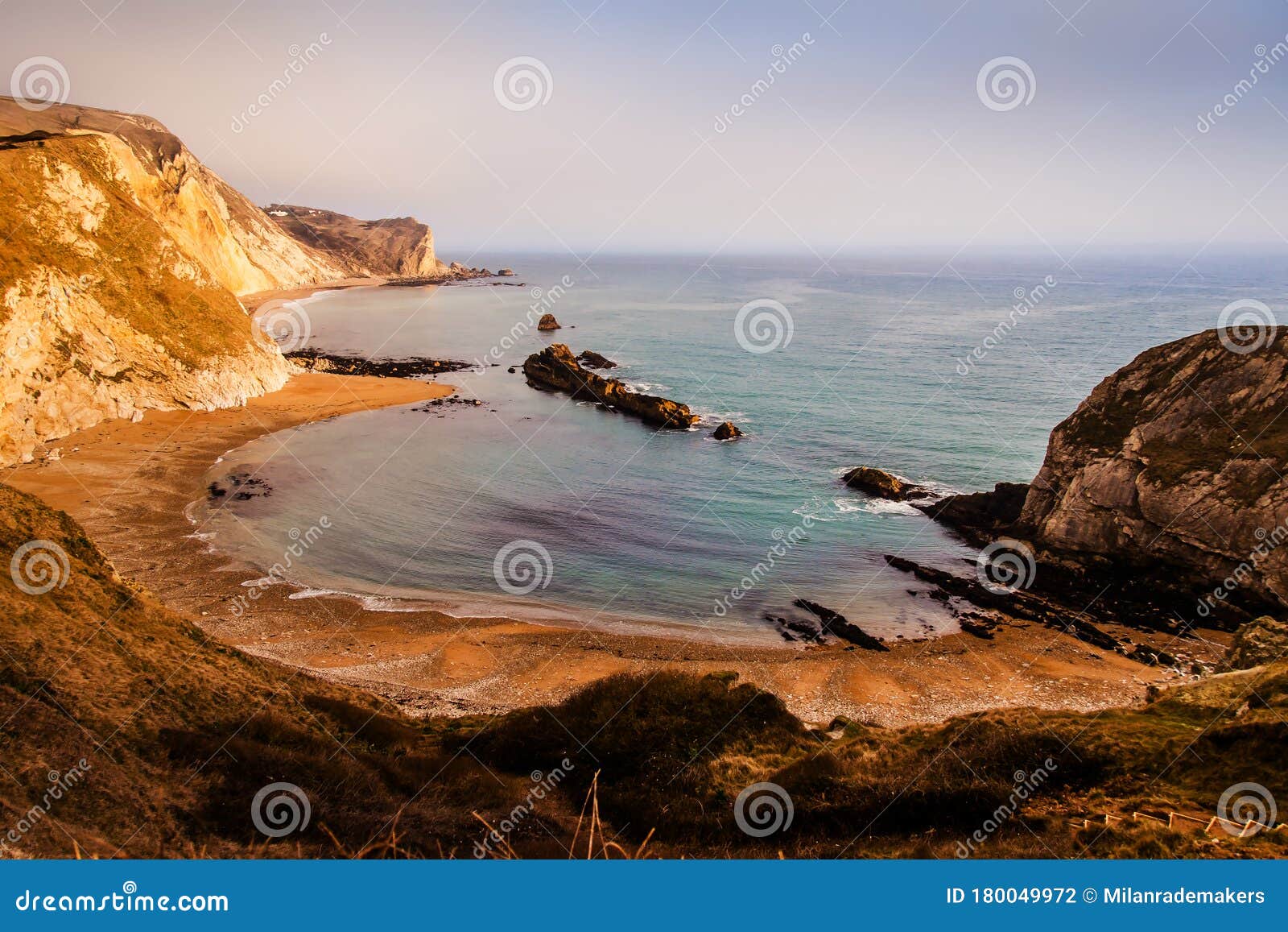 A Beach in a Bay with Cliffs on the Jurassic Coast of England Stock ...