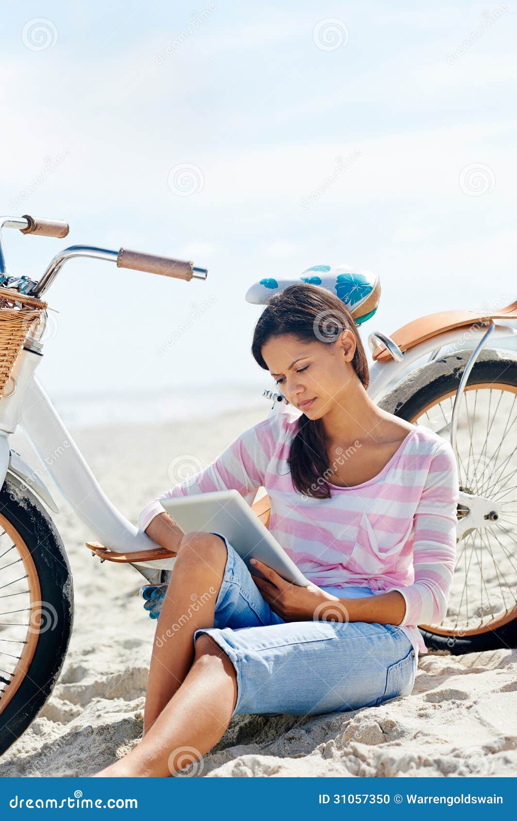 Beach bicycle tablet woman stock photo. Image of female - 31057350