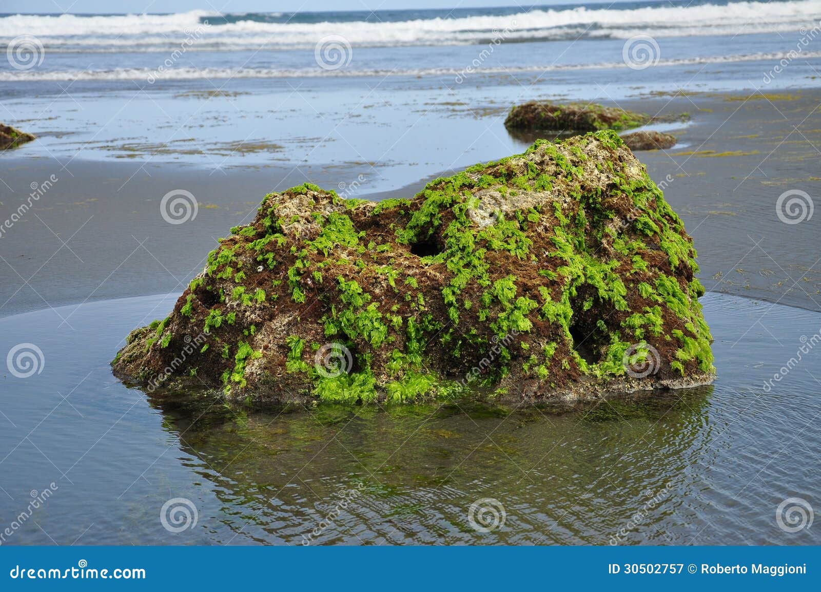Beach boulder, mini island stock image. Image of shore - 30502757