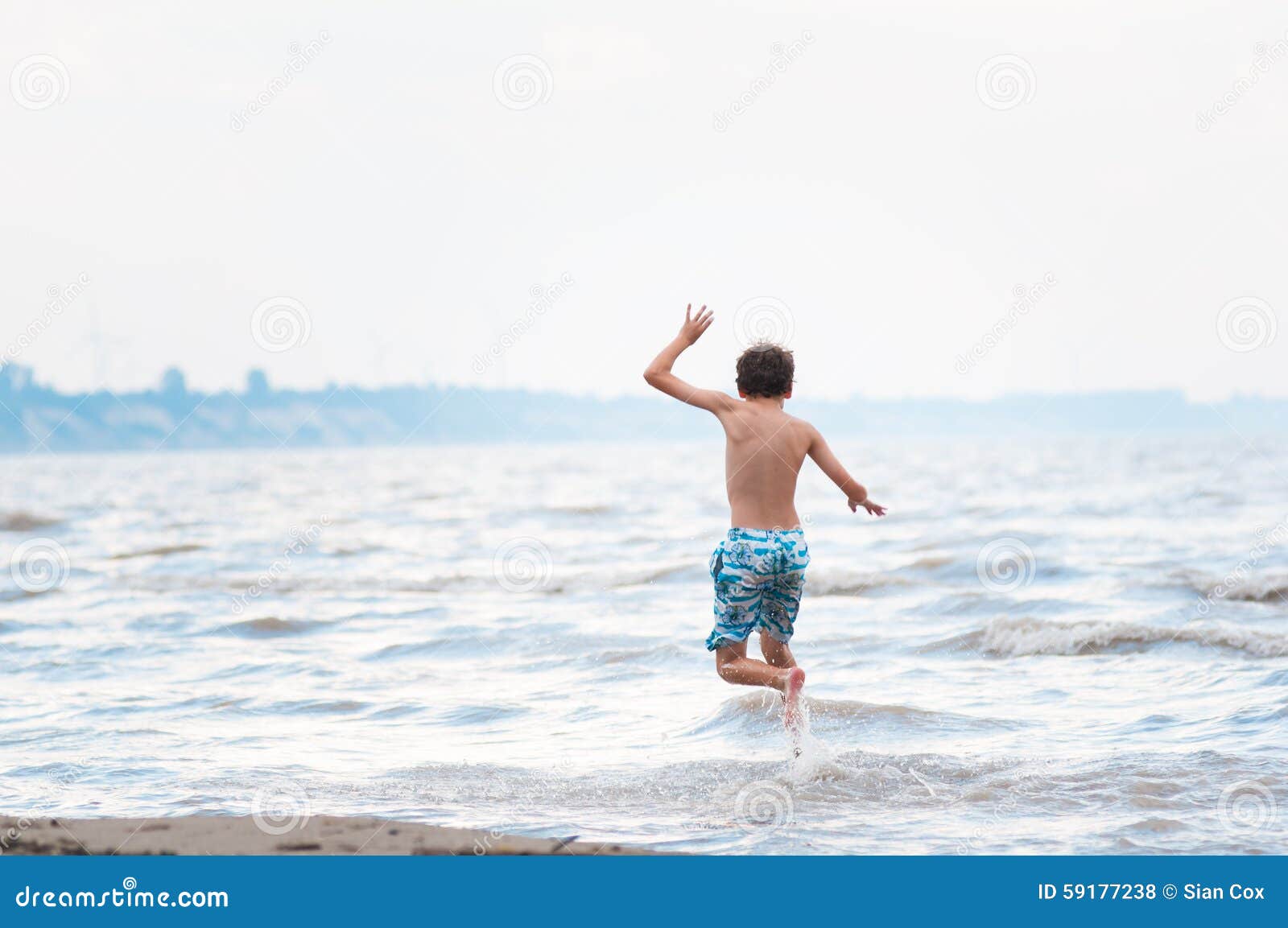 Beach boy stock photo. Image of waves, enjoyment, shore - 59177238
