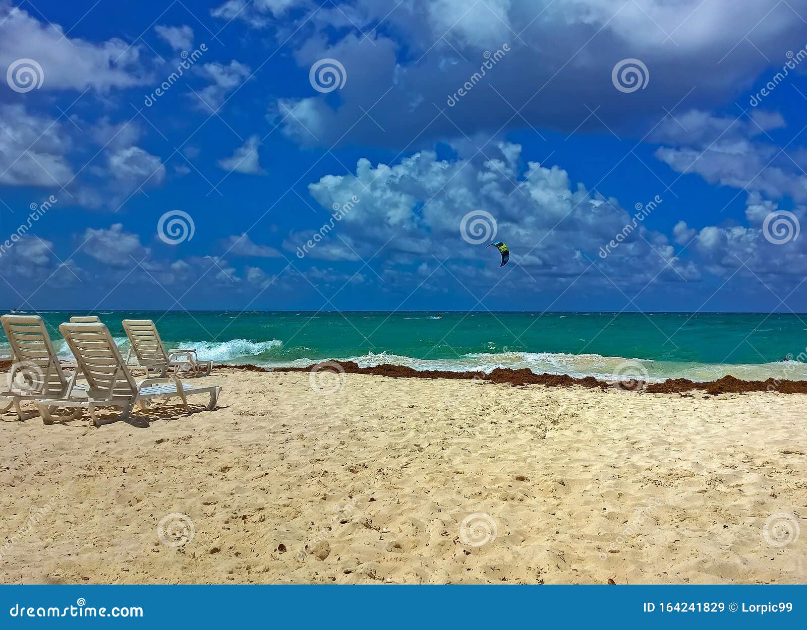 Caribbean Beach with Chairs and Surf Gliding Stock Image - Image of ...