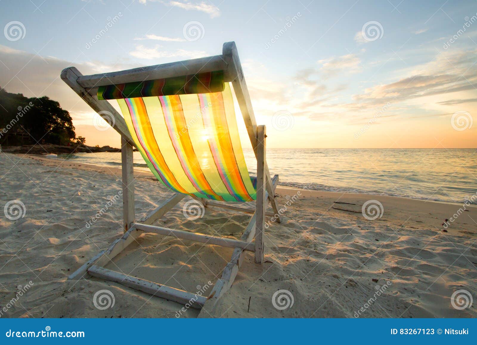 Beach chair at sunset stock image. Image of beach, relaxation - 83267123