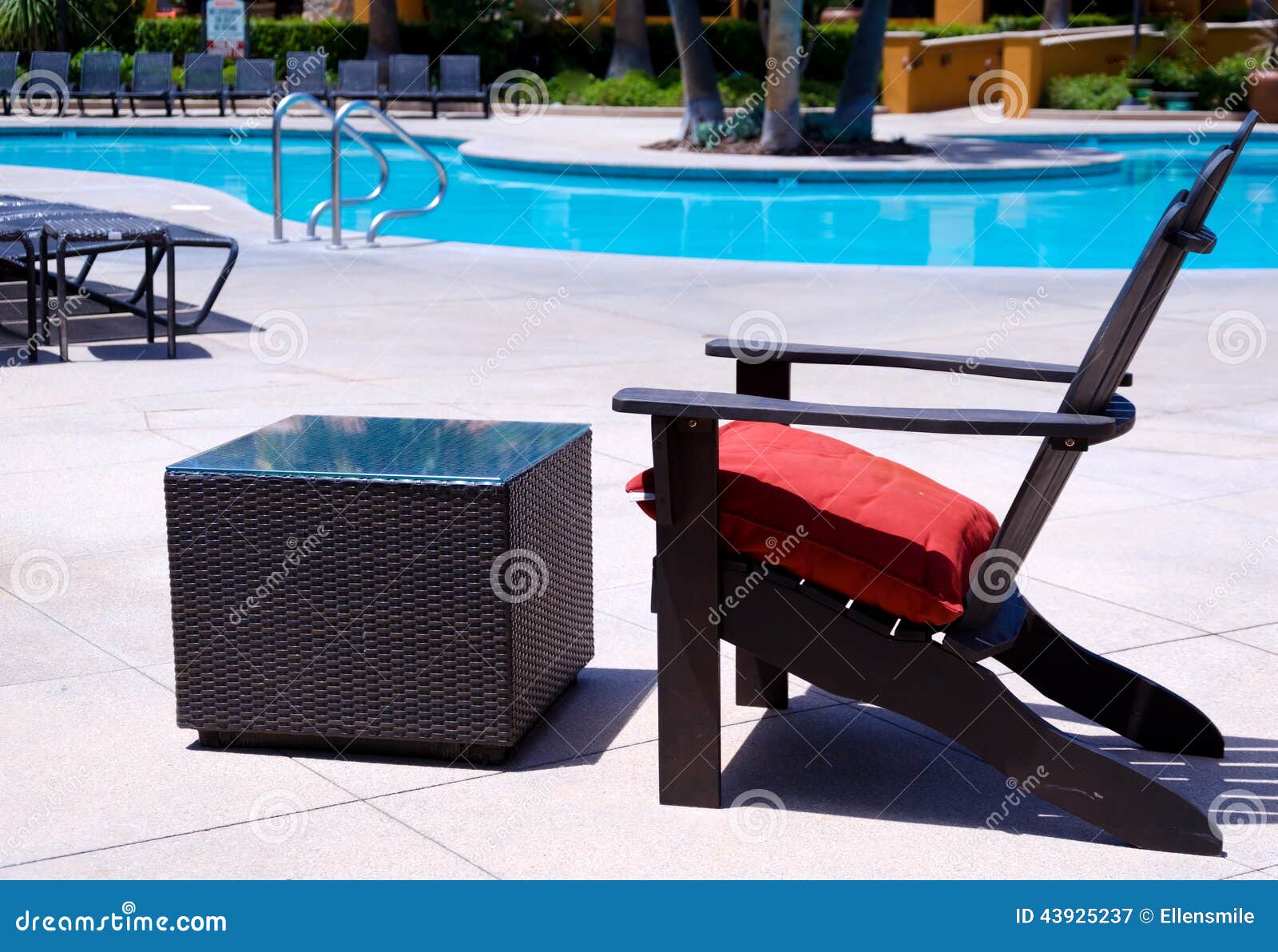 Beach Chair and Table by a Pool Stock Image - Image of blue, palm: 43925237