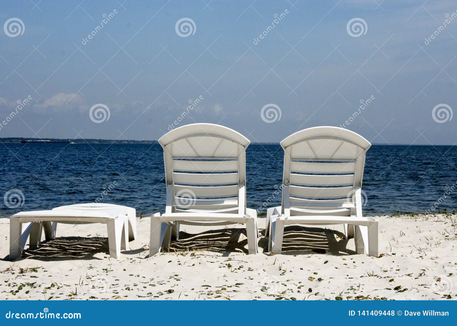 Beach Chairs on a Sandy Ocean Coastline Stock Photo - Image of water ...
