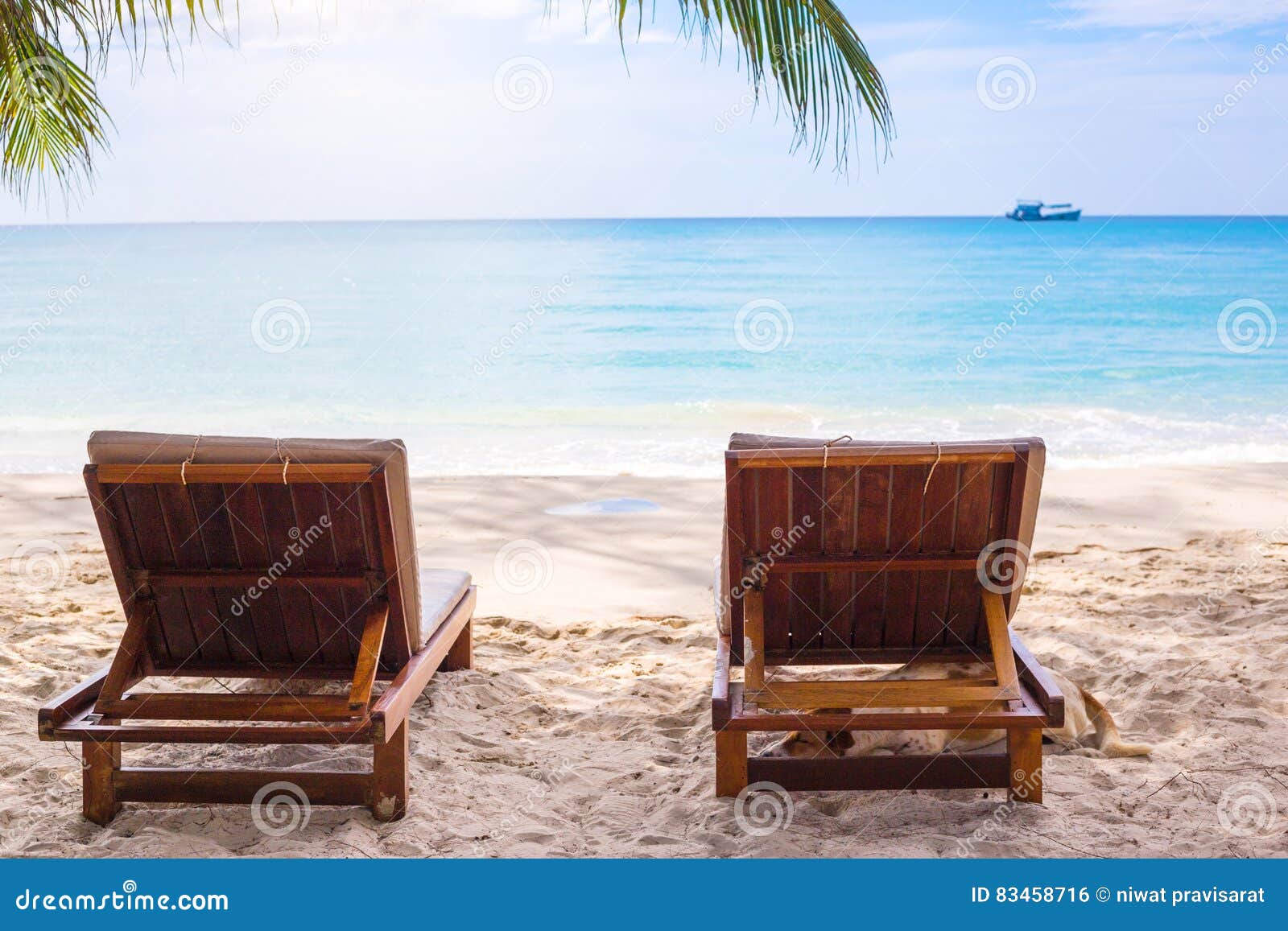 Beach Chairs on the White Sand Beach with Blue Sky and Sun Stock Photo ...