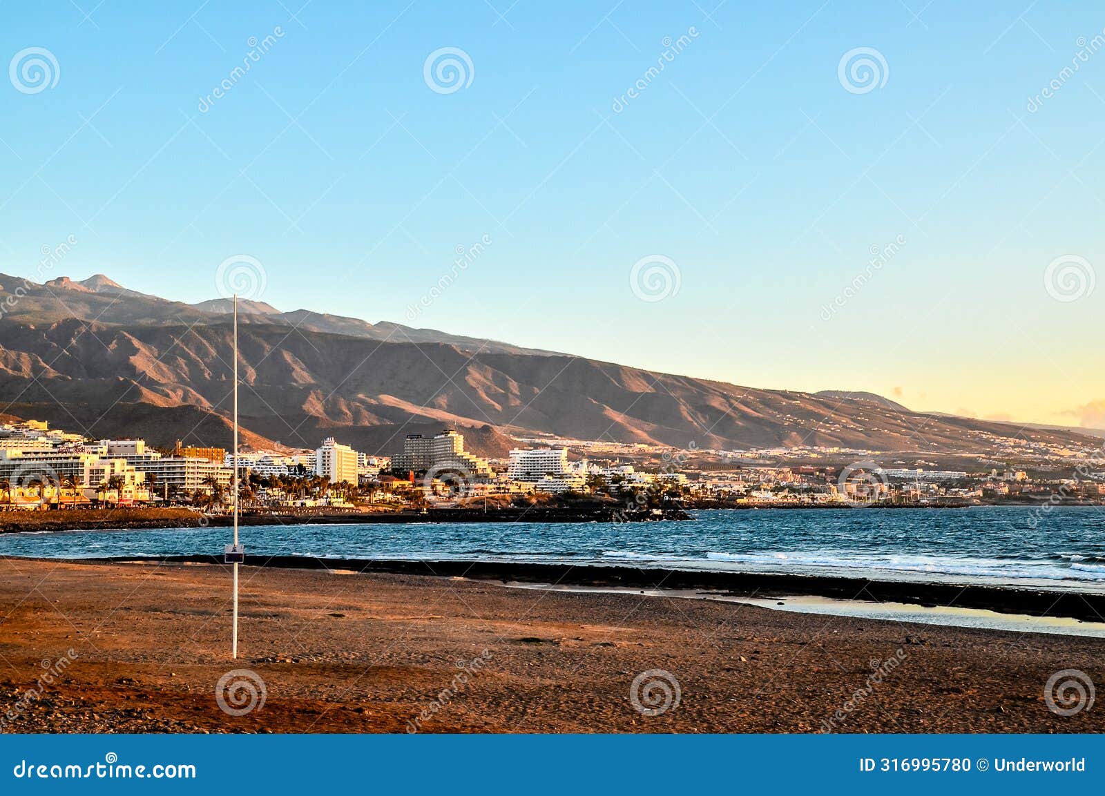 A Beach with a City in the Background Stock Photo - Image of coast ...