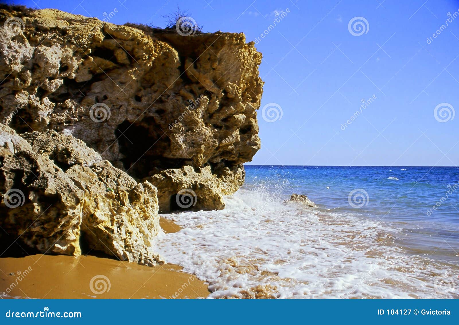 Beach cliff stock image. Image of cliff, splashes, algarve - 104127