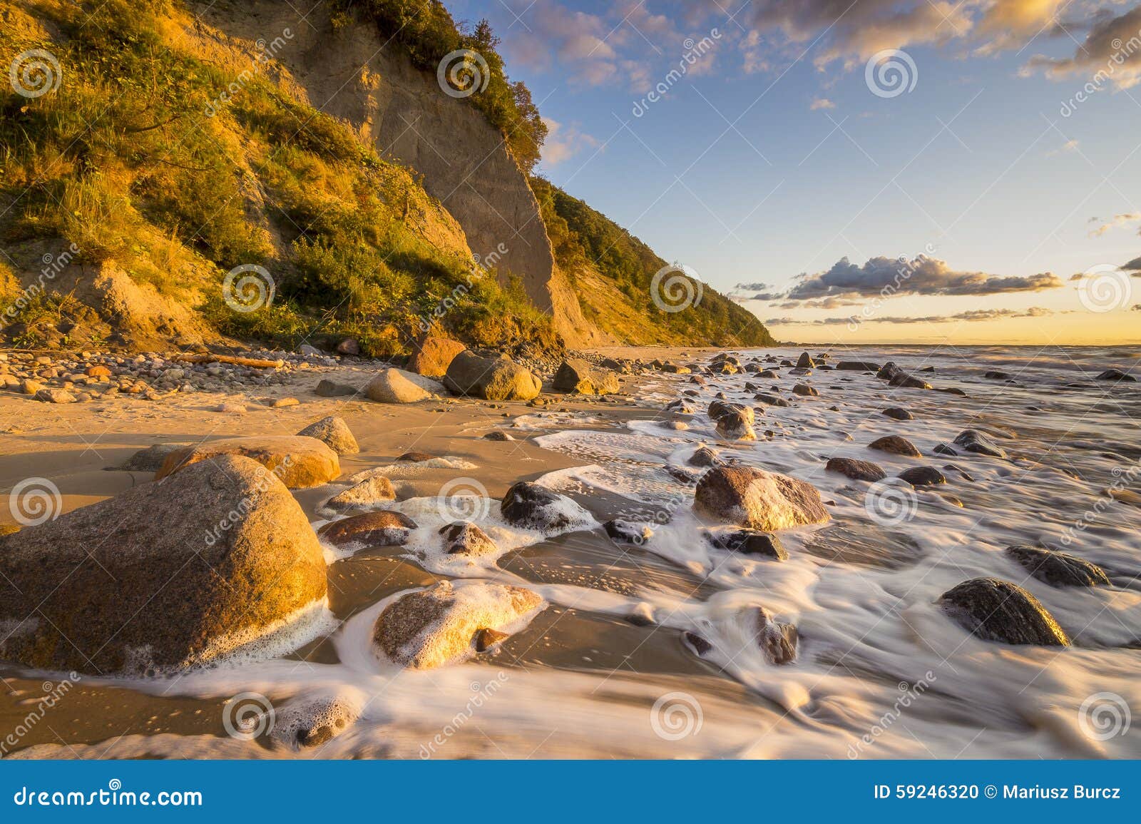 Beach and Cliff in the Light of the Wonderful Sunset Stock Photo ...