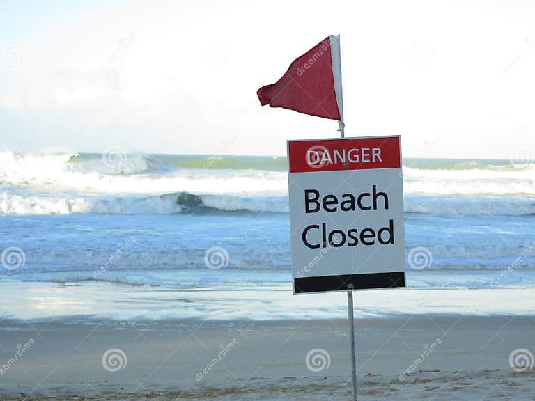 Beach Closed Warning Sign by Dangerour Conditions Stock Image - Image ...