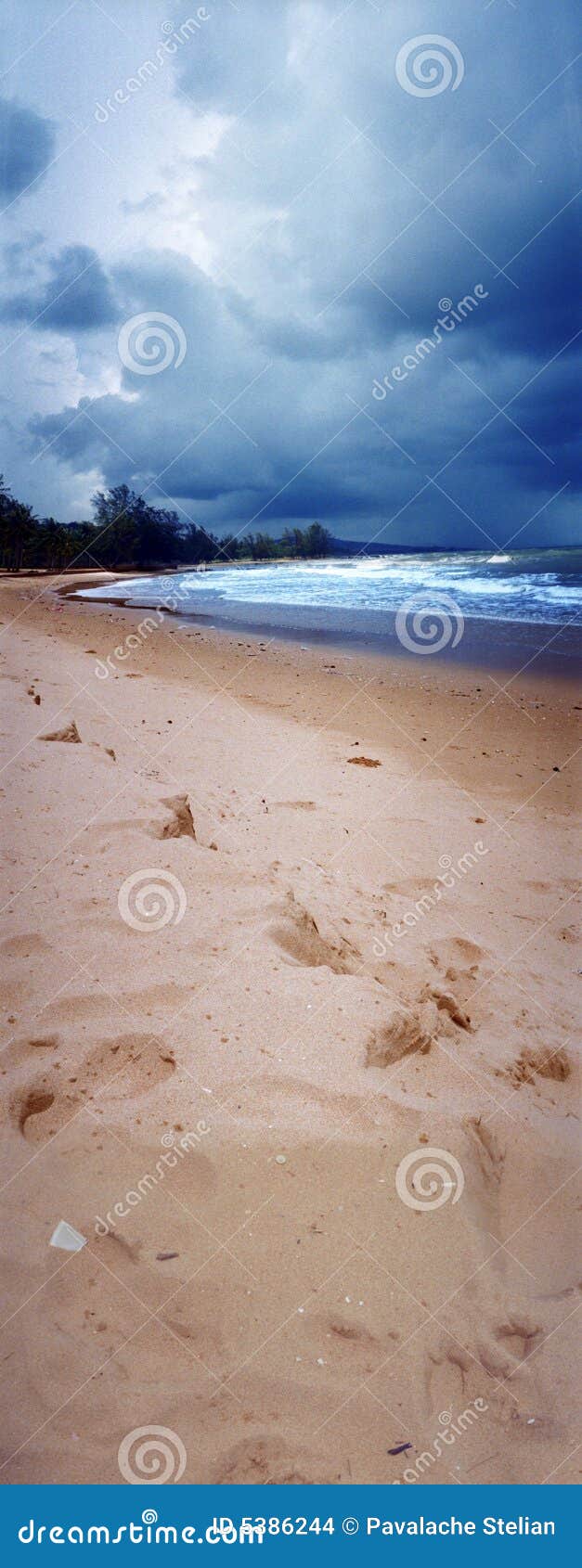 Beach on a cloudy day stock photo. Image of color, sand - 5386244