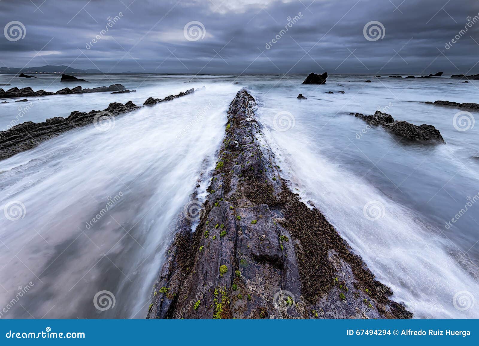 Beach stock photo. Image of water, sand, rock, green - 67494294