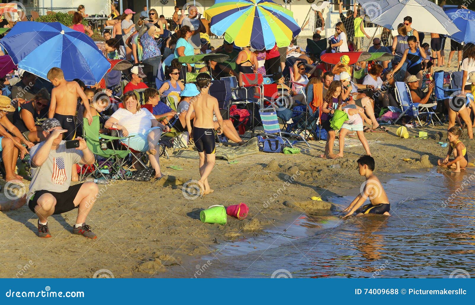 Beach Crowd editorial stock photo. Image of family, jersey - 74009688