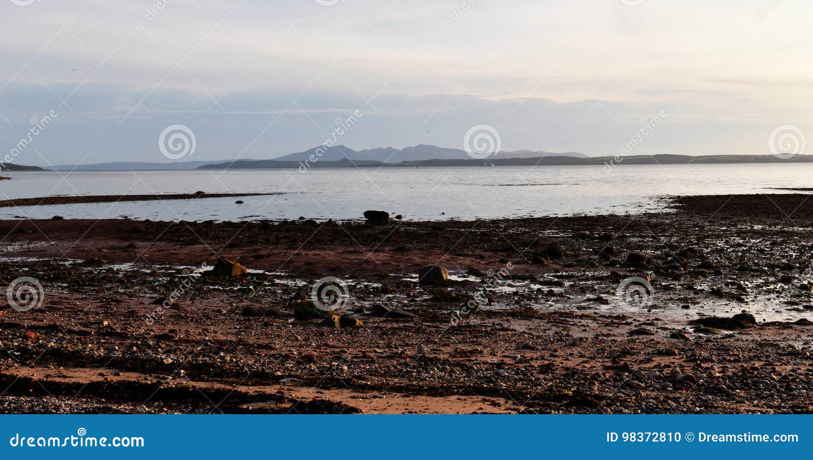 Beach with Distant Mountains at Dusk. Stock Photo - Image of island ...
