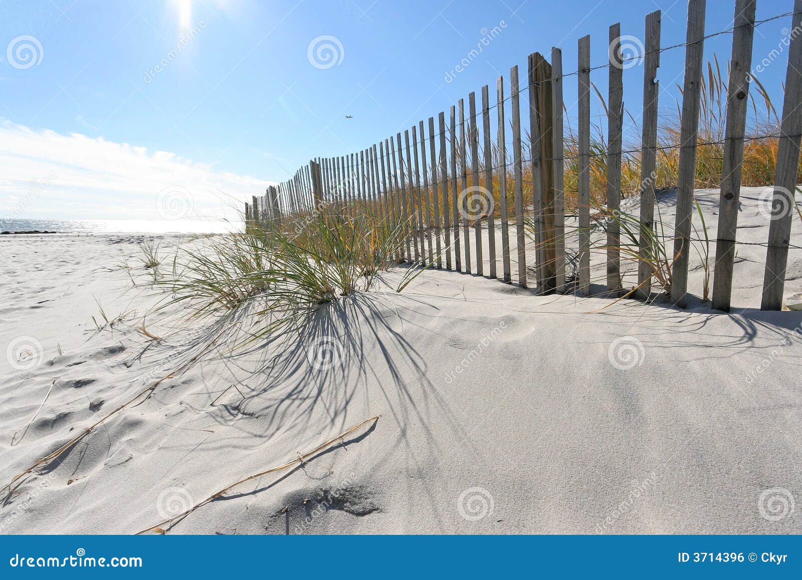 Beach fence stock photo. Image of dune, peaceful, clouds - 3714396