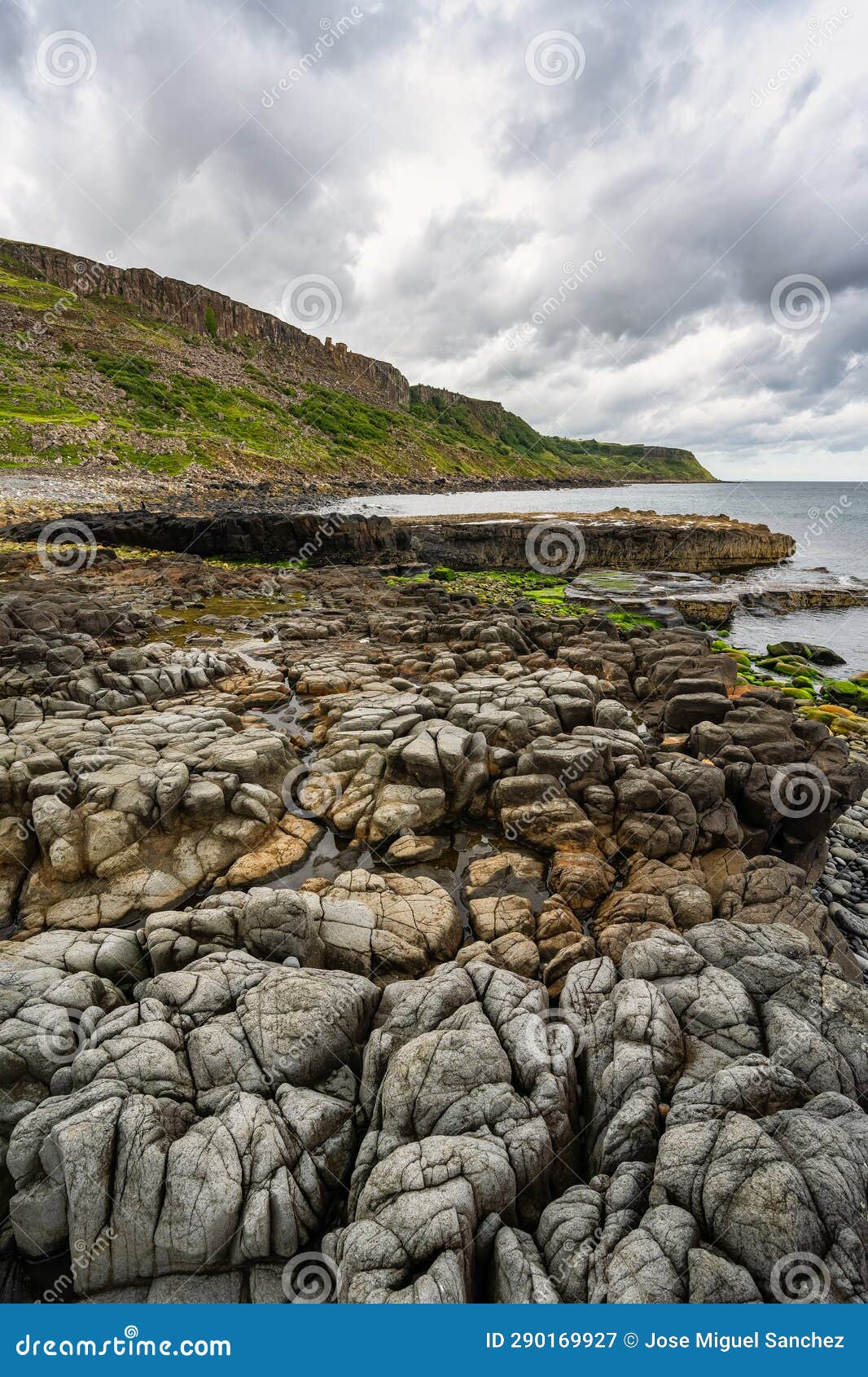 Beach Full of Large Rocks Eroded by Waves and Cliffs on the Isle of ...