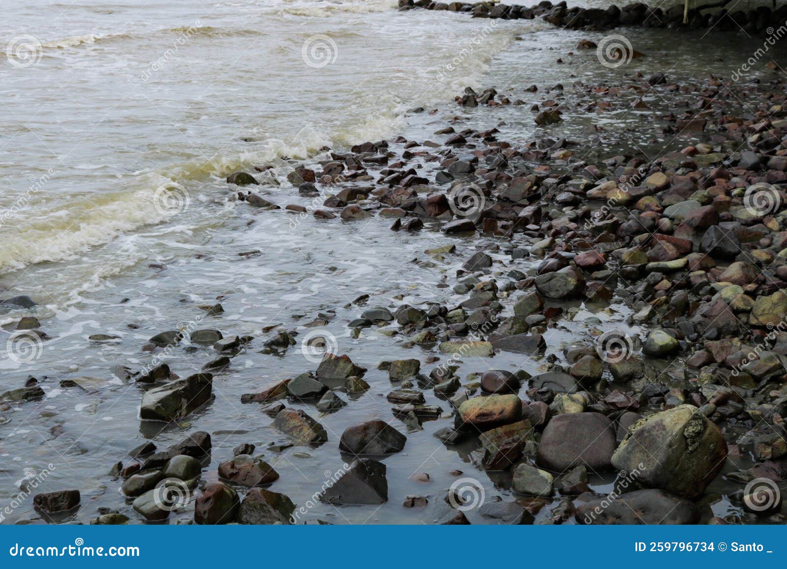 The Beach is Full of Rocks and Waves Stock Photo - Image of ocean ...