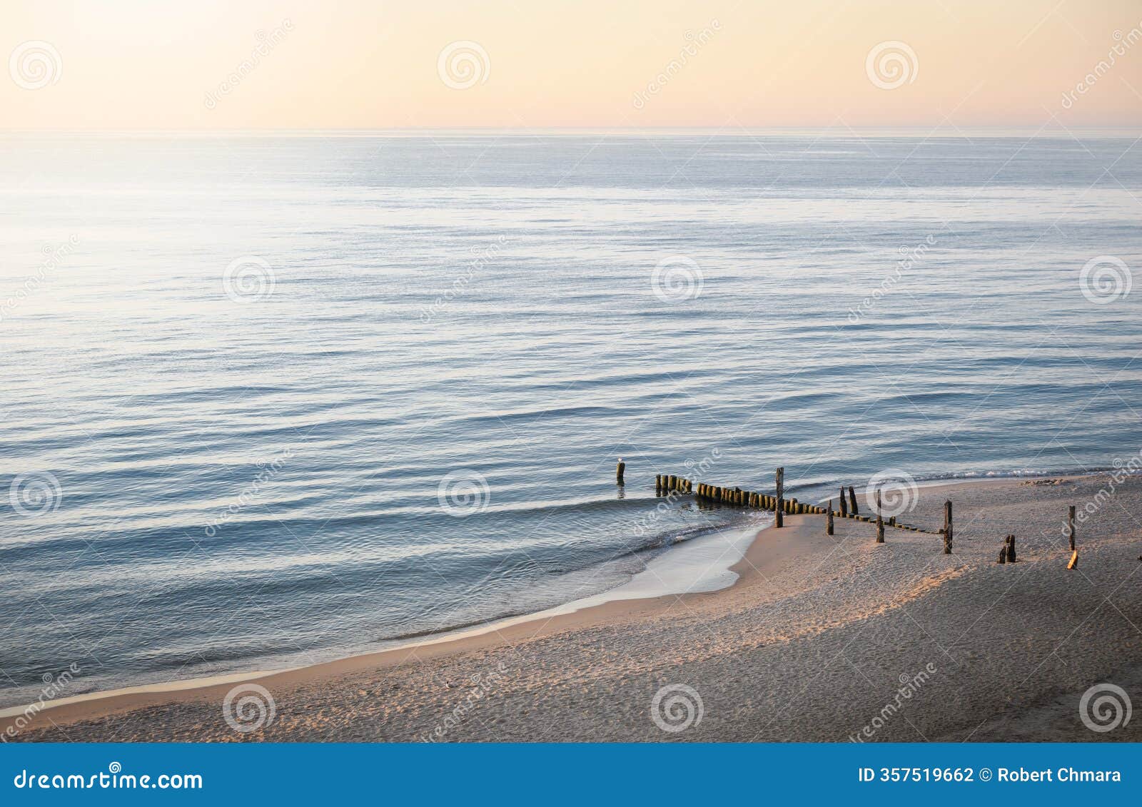 Beach with Groynes and Calm Water at Dusk Stock Photo - Image of orange ...