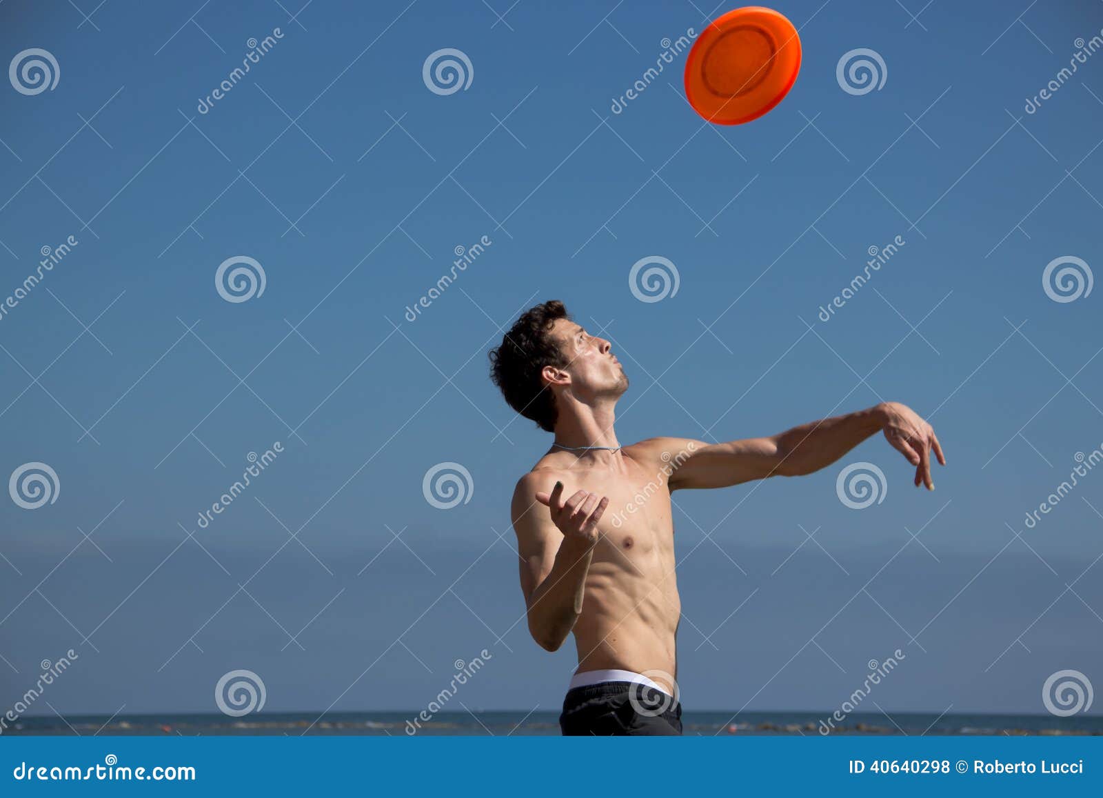 Beach Guy Look at Flying Frisbee Stock Photo - Image of athletic ...