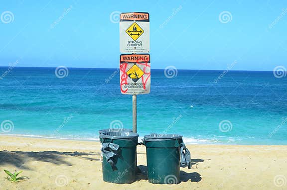 Beach Hazard Signs and Dustbins Stock Photo - Image of signpost ...