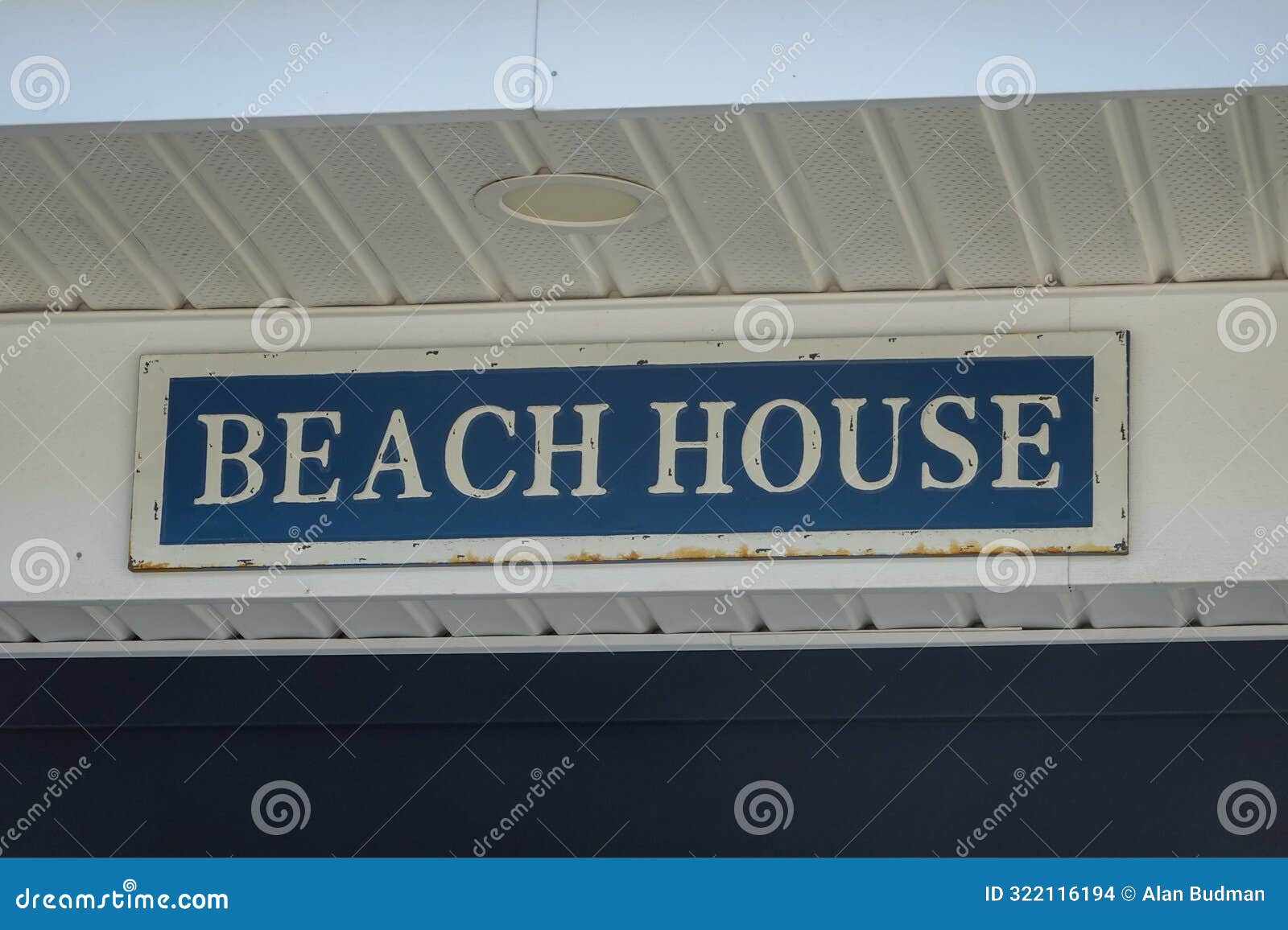 Beach House Sign on a House with White Letters and Blue Background ...