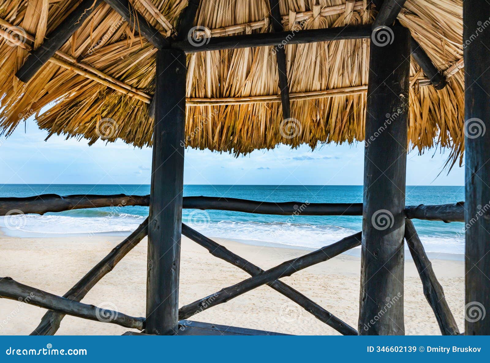 Beach Hut with a Straw Roof Sits on the Beach Stock Image - Image of ...