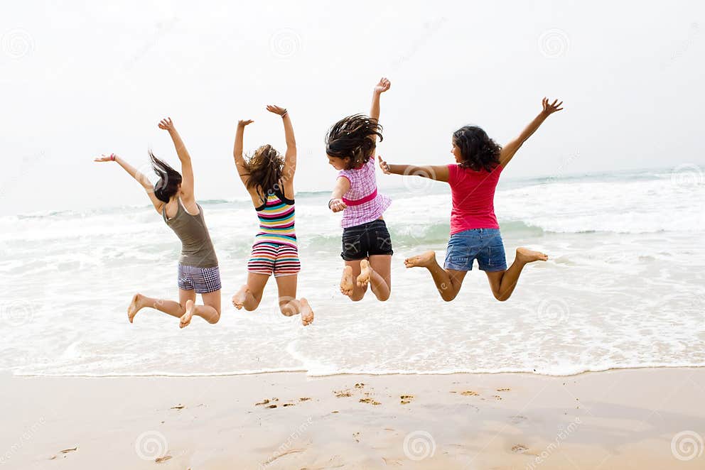 Beach jump stock photo. Image of four, games, joyful - 10972442