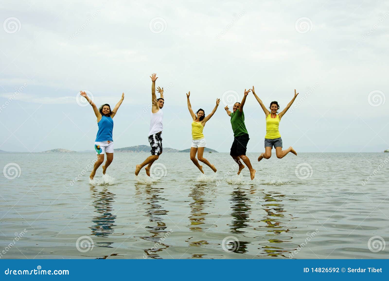 Beach Jumping stock photo. Image of friend, holiday, beach - 14826592