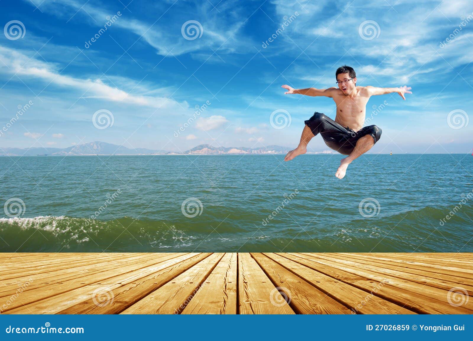 Beach jumping man stock image. Image of coast, field - 27026859