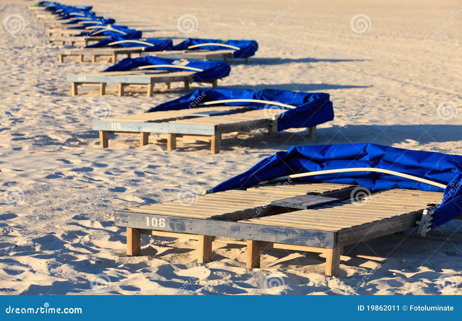 Beach Lounge Chairs stock image. Image of umbrella, lounge - 19862011