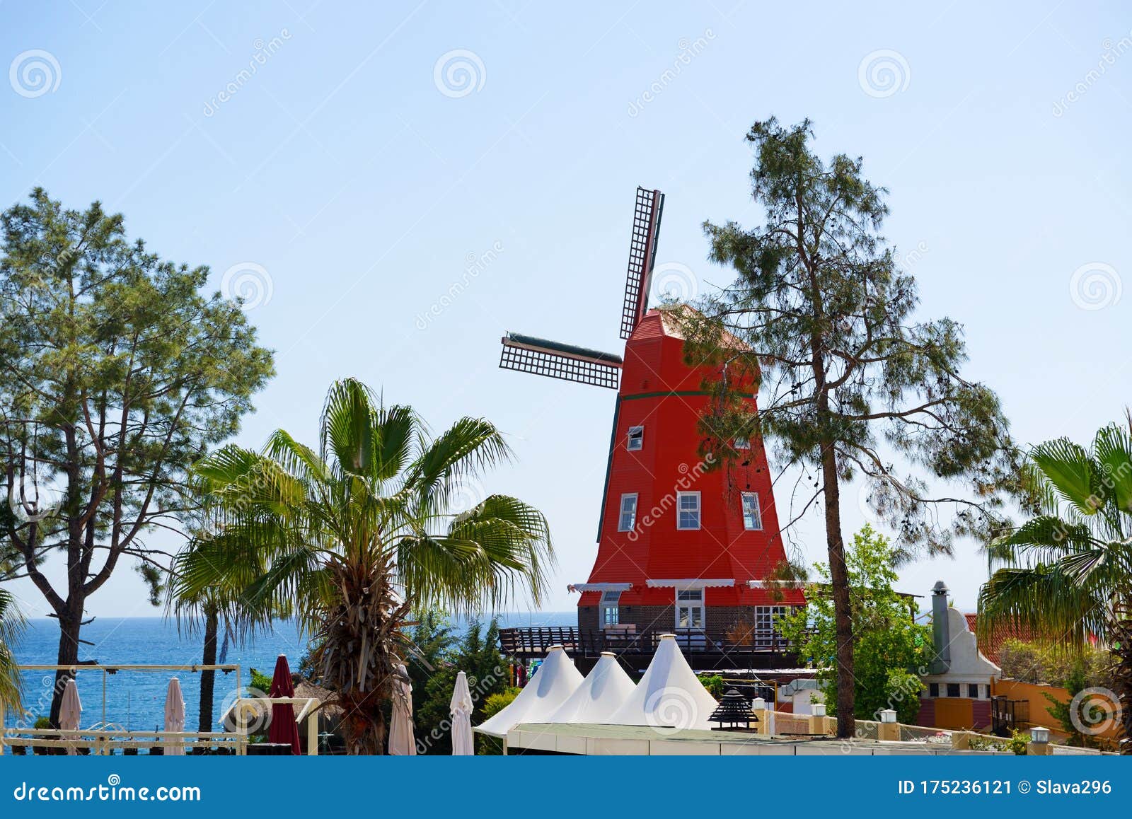 The Beach at Luxury Hotel with Dutch Windmill Stock Image - Image of ...