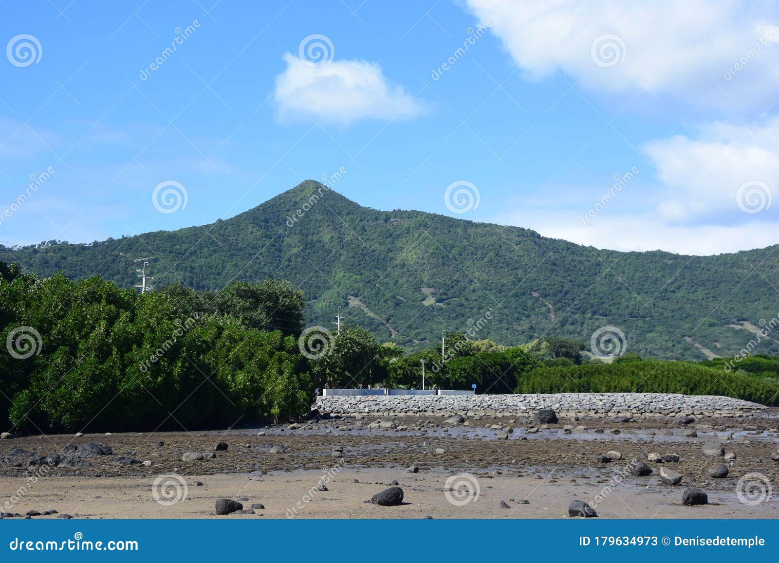 A Beach with a Mountain in the Background Stock Image - Image of ...