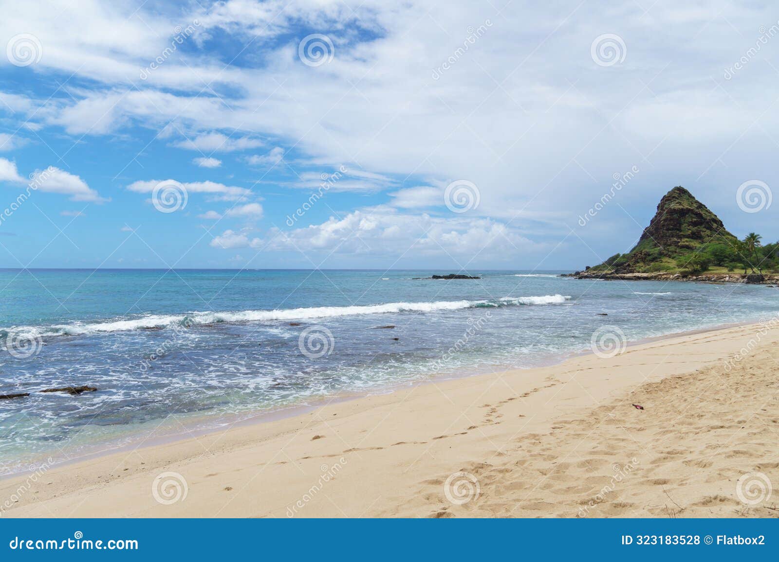 Beach with Mountain, Ocean Waves, Cloudy Sky in Background Stock Photo ...