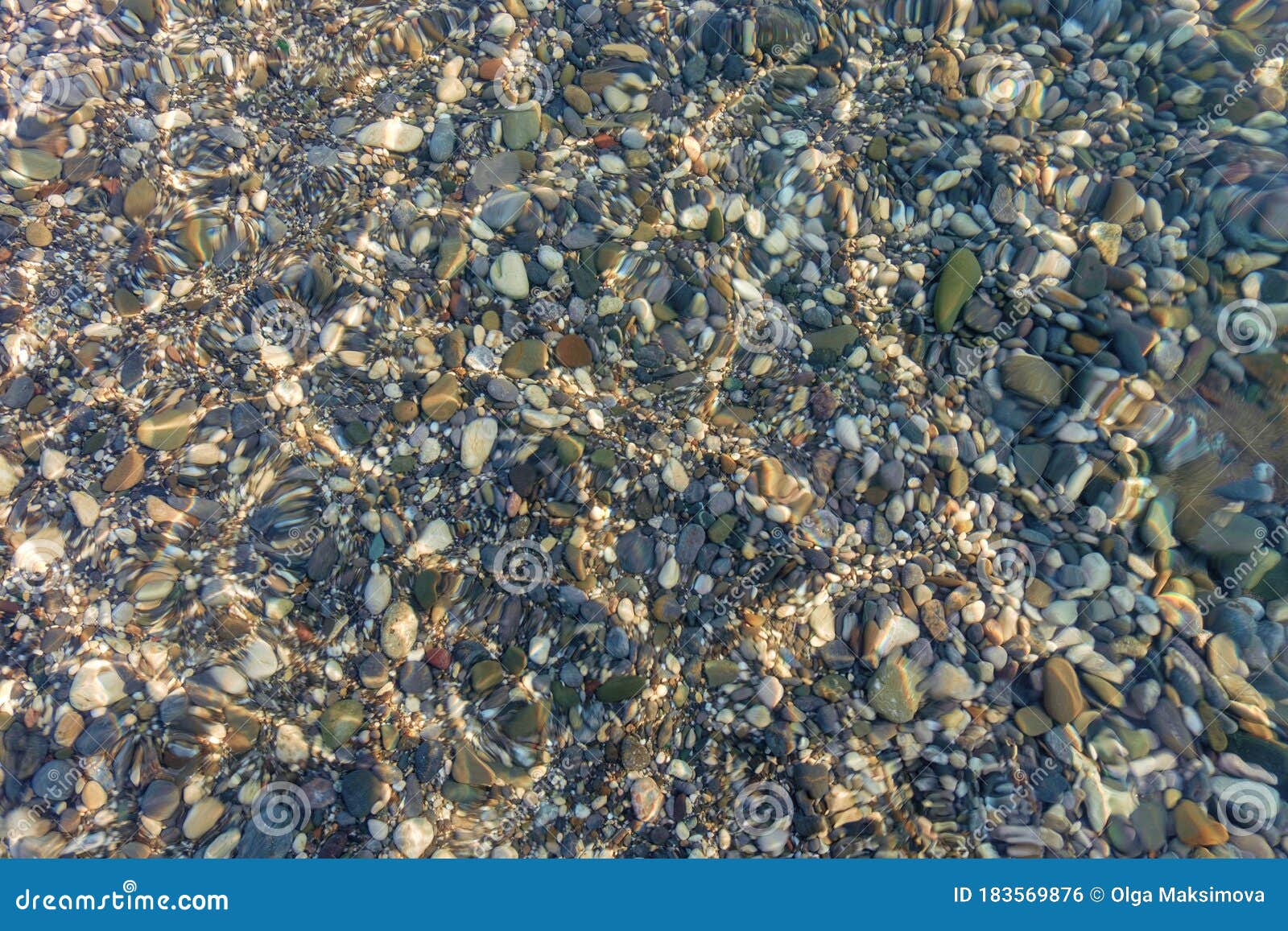 Beach Pebbles Under Clear Water with the Solar Pattern of Ripples Stock ...