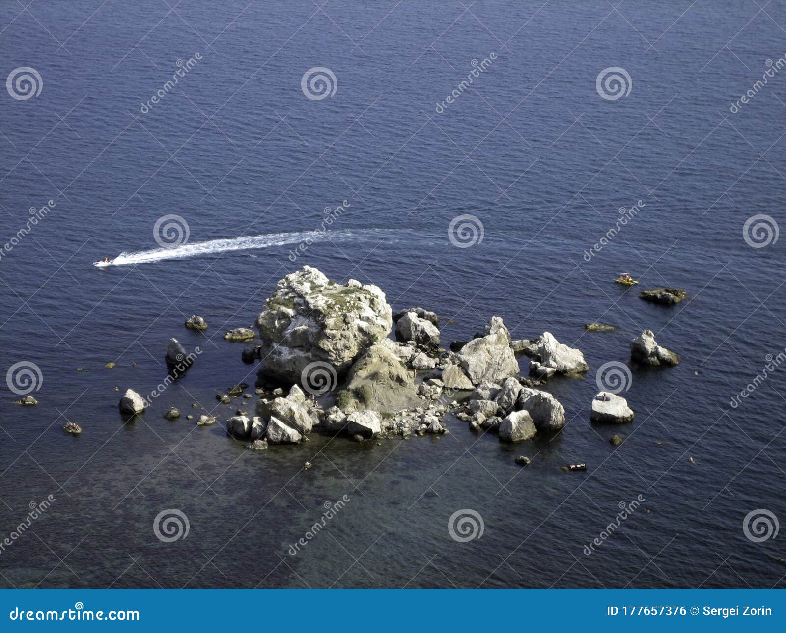 Beach and Piles of Stones in the Sea Near the Shore Stock Photo - Image ...