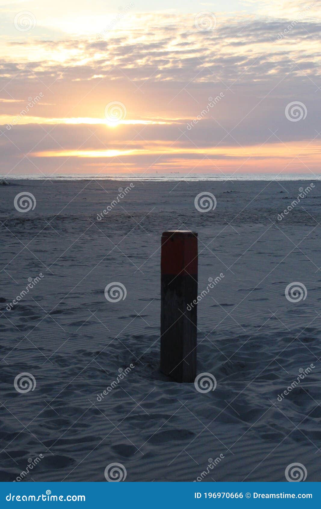 Beach Pole at Sunset stock photo. Image of orange, colour - 196970666