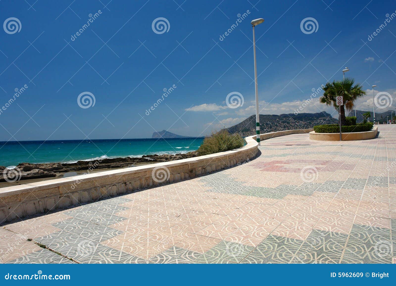The Beach And The Promenade With Palm Trees And Stone Wall In Morro ...