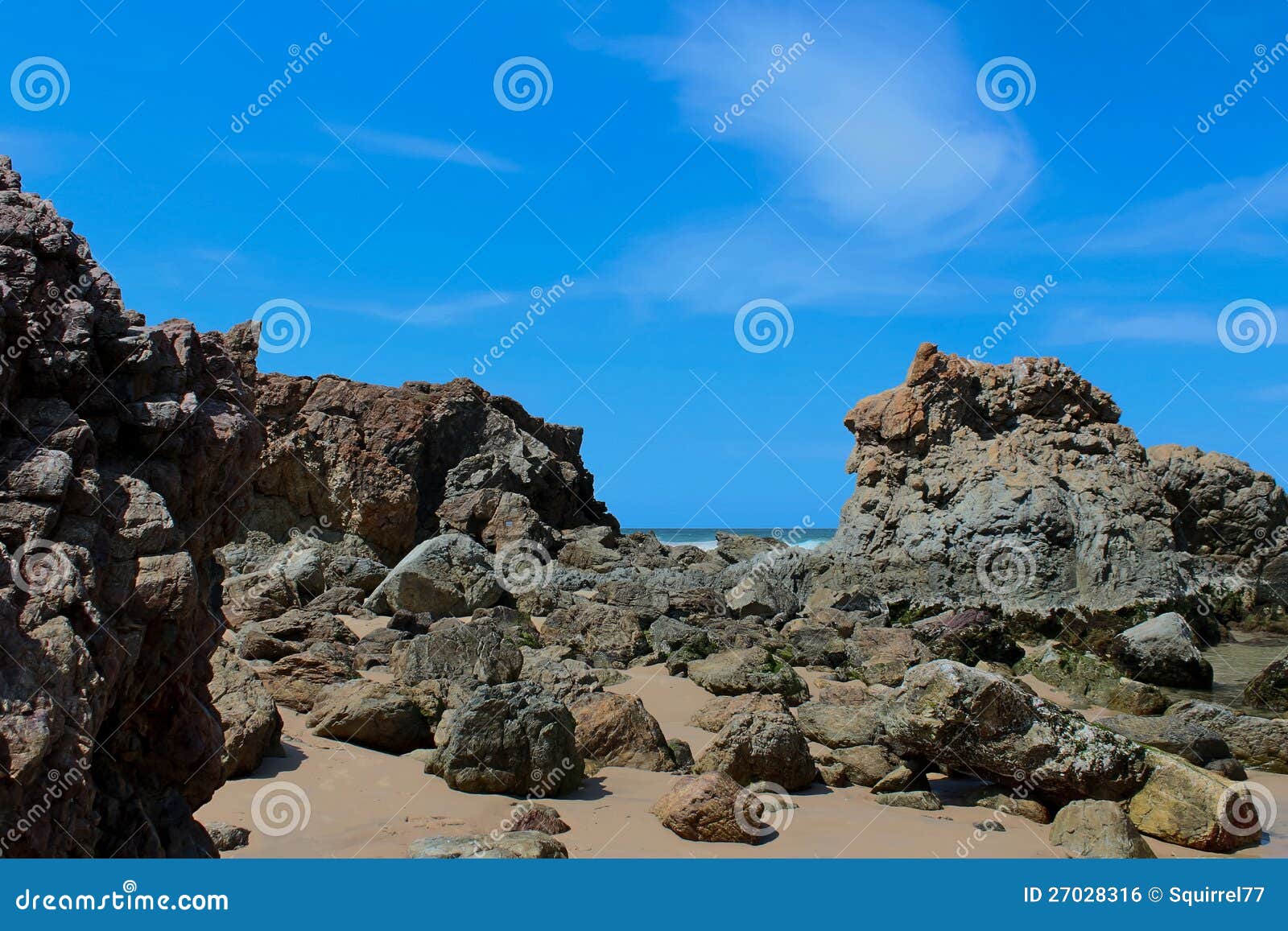 Beach Rock Formation Against Blue Sky Stock Photo - Image of seascape ...