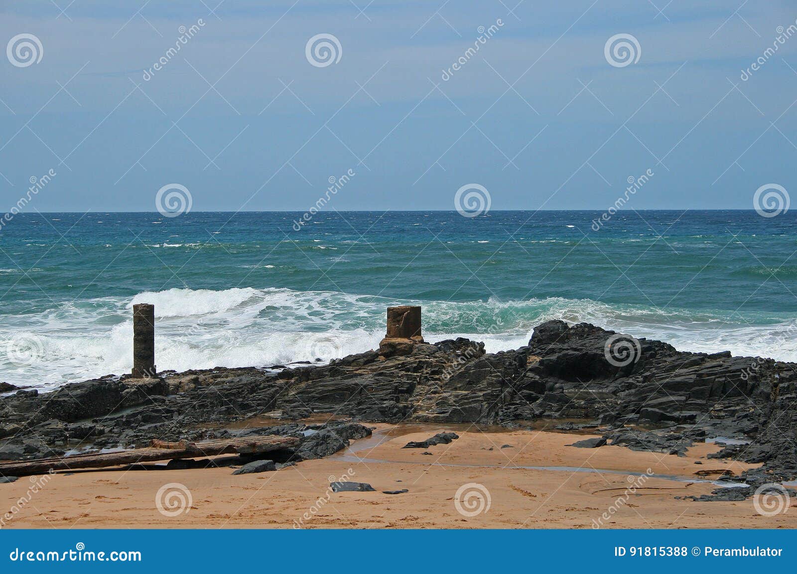 BEACH with ROCKS and PILLAR REMNANTS Stock Photo - Image of ocean ...