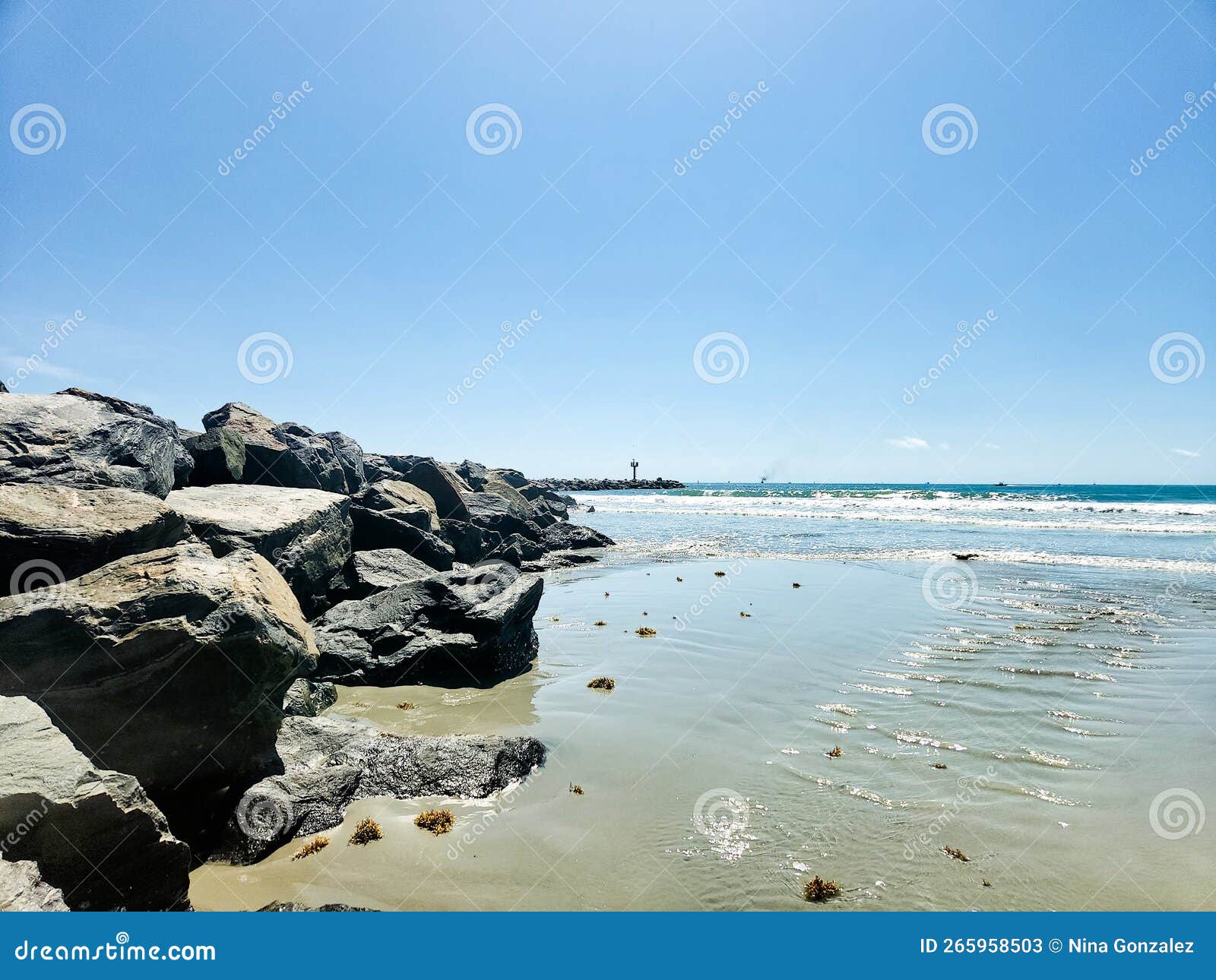 Beach rocks sand ocean stock image. Image of wave, horizon - 265958503